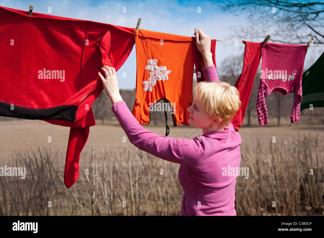 Wet clothes hanging hi-res stock photography and images - Alamy