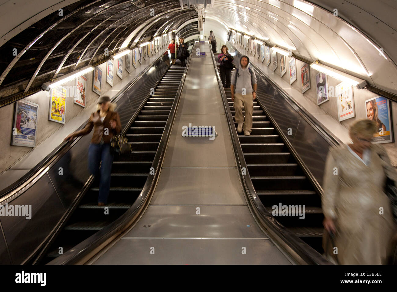 The underground escalator system at Oxford circus station Stock Photo ...