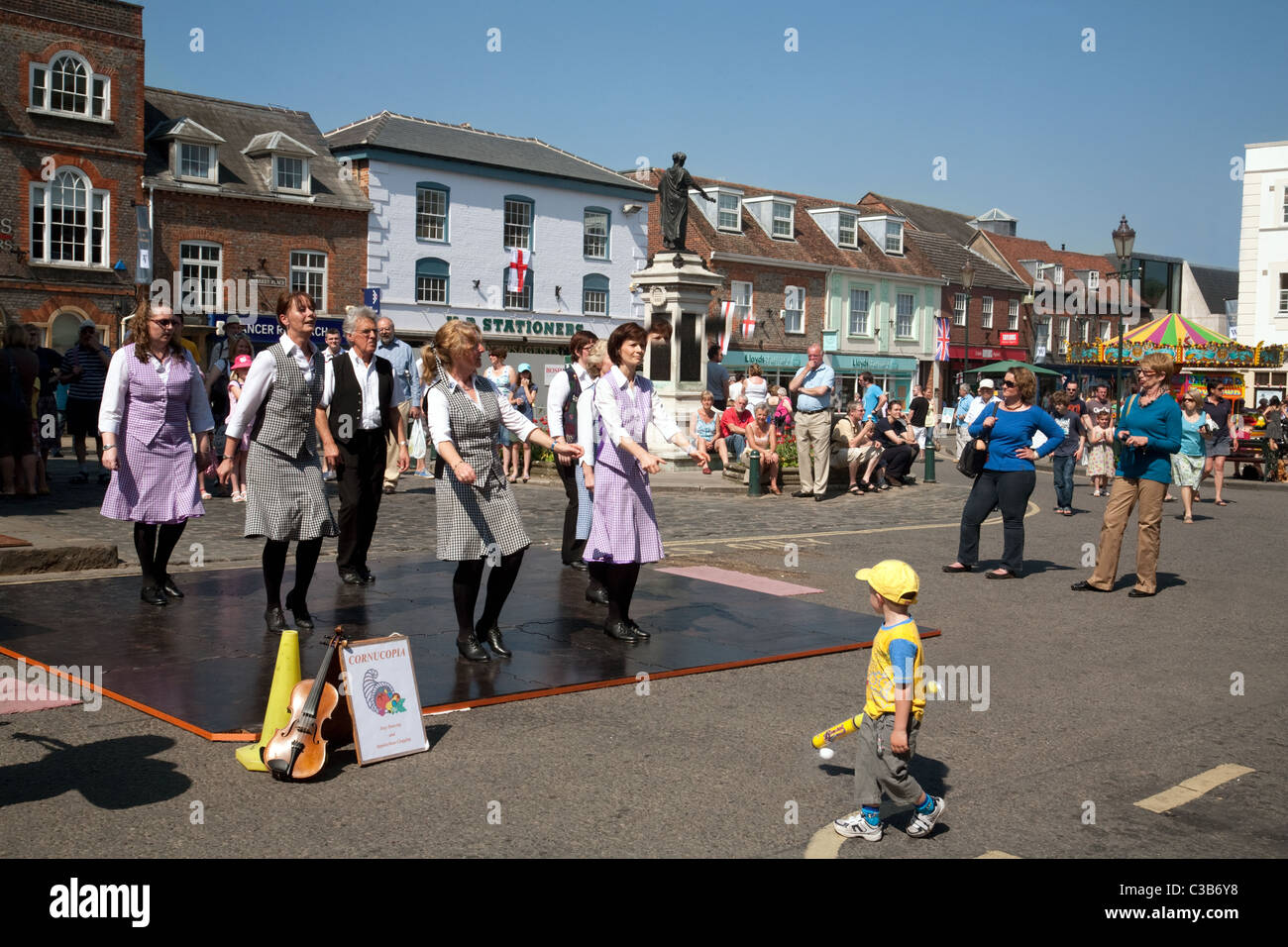 A young boy watching tap dancers at Wallingford town fair, Oxfordshire ...