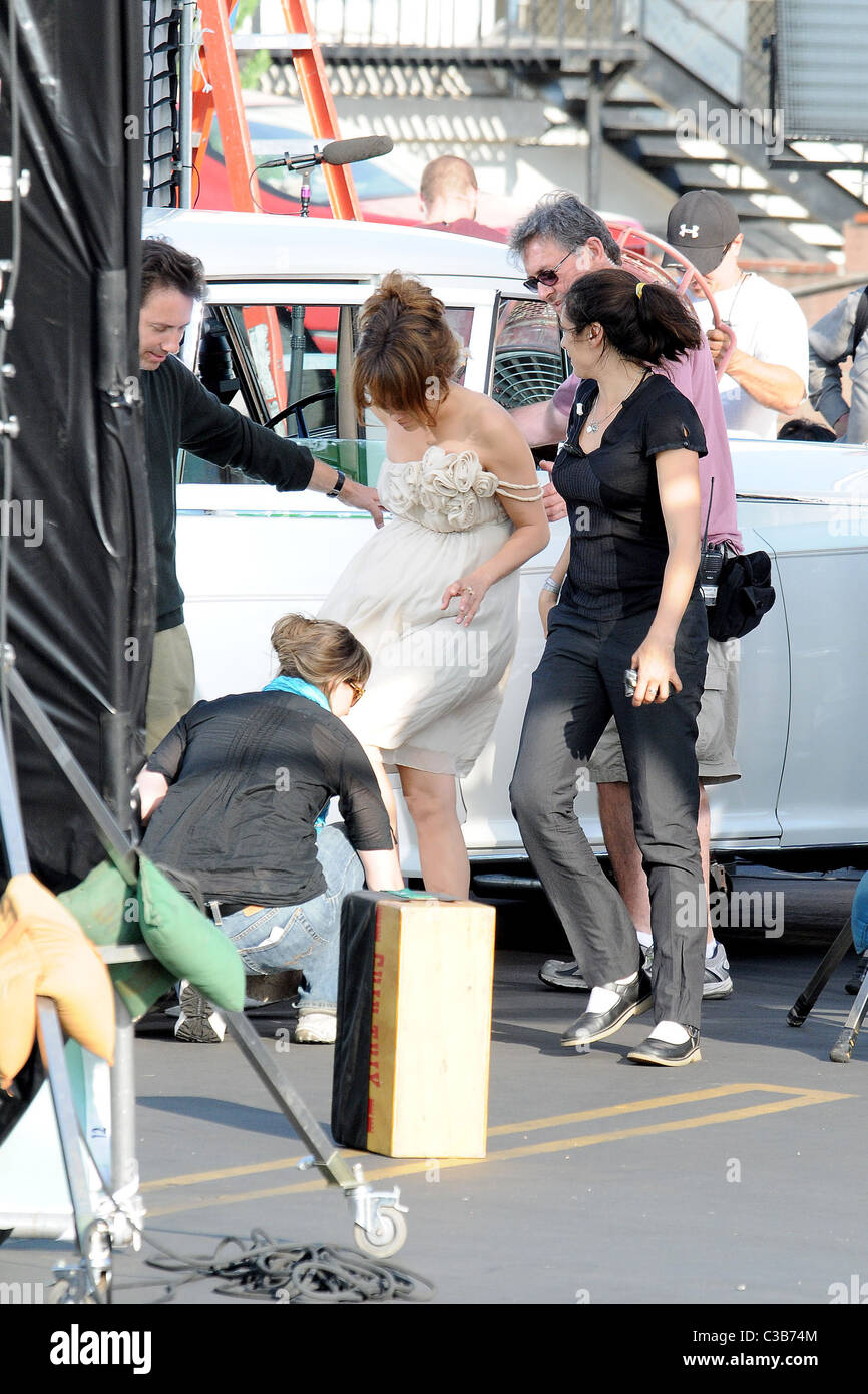 Jennifer Lopez showing off a prosthetic baby bump while on the set of ...