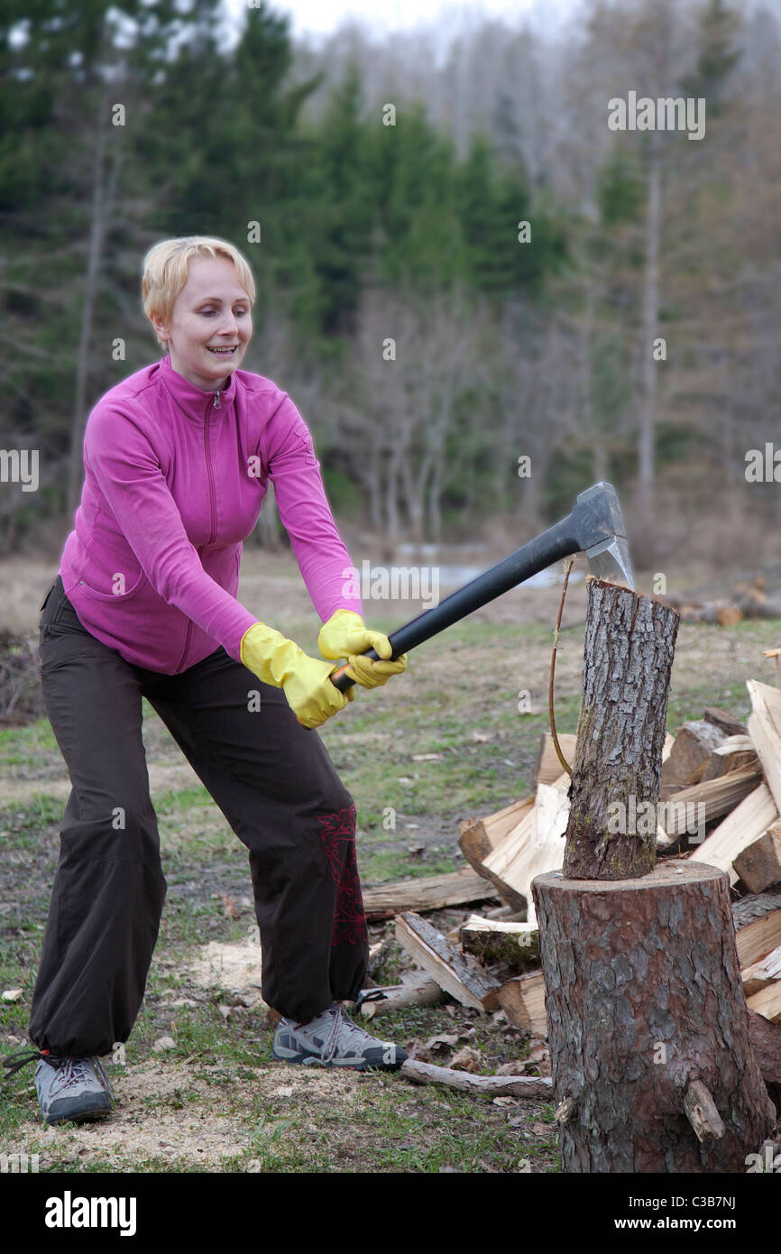 Caucasian Woman Slipping and Chopping Firewood Using Axe Stock Photo ...