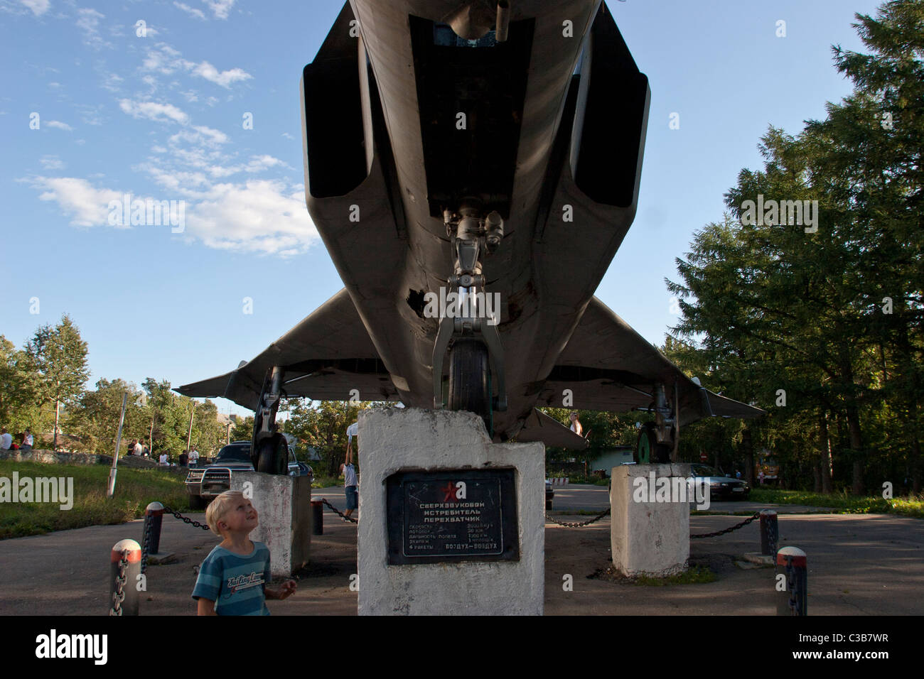 Children play near a memorial of a Soviet era fighter jet in Yuzhno ...