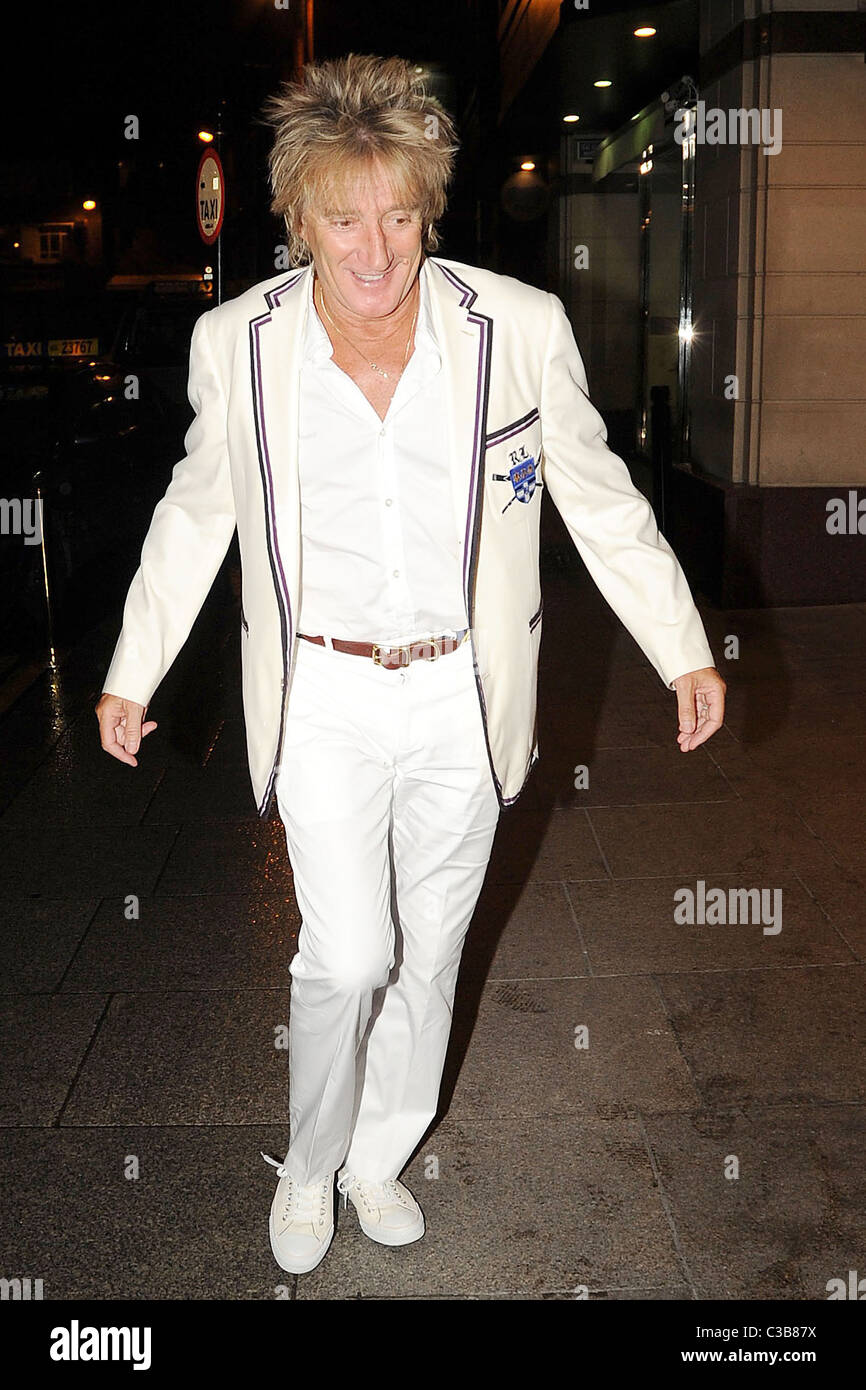 Rod Stewart arriving back at his hotel, wearing an all white ensemble ...