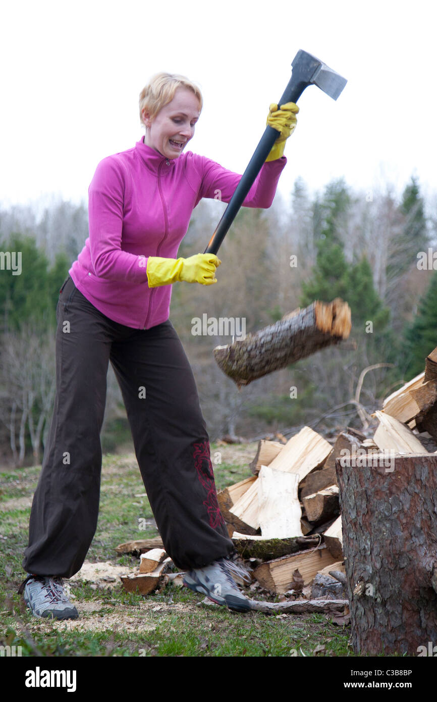 Woman chopping wood axe hi-res stock photography and images - Alamy