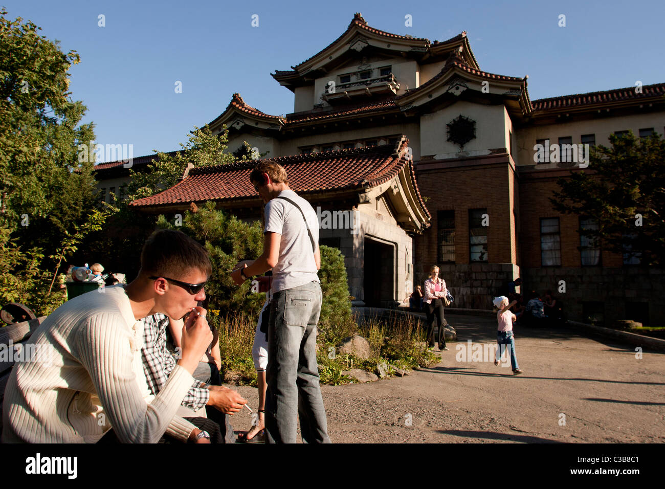 People enjoy the grounds of the Sakhalin Regional Museum in Yuzhno ...