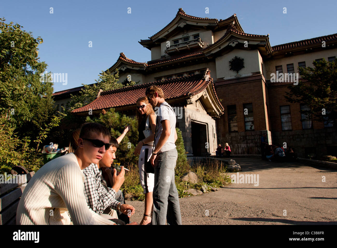 People enjoy the grounds of the Sakhalin Regional Museum in Yuzhno ...
