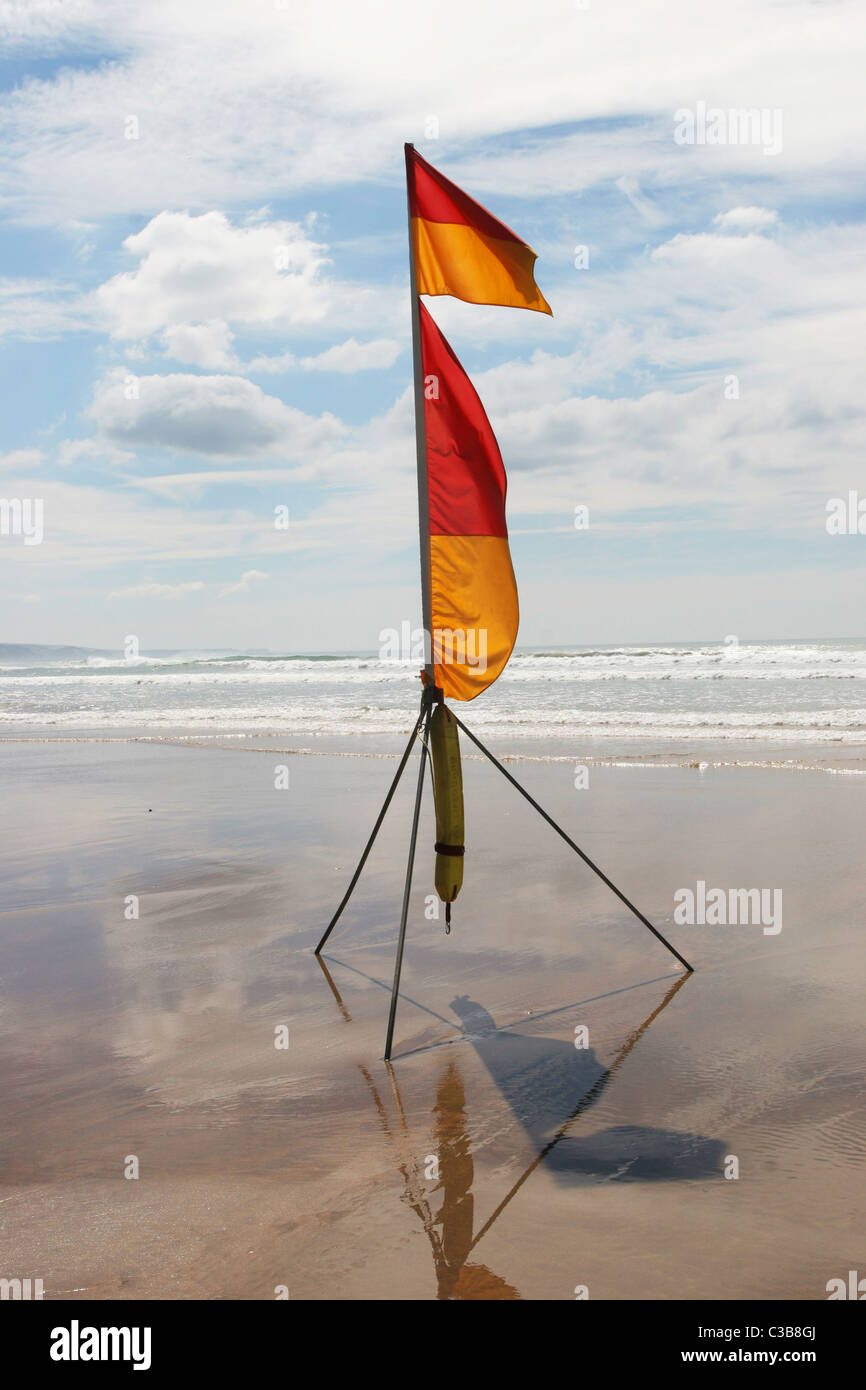 Life guard flag on a beach Stock Photo - Alamy