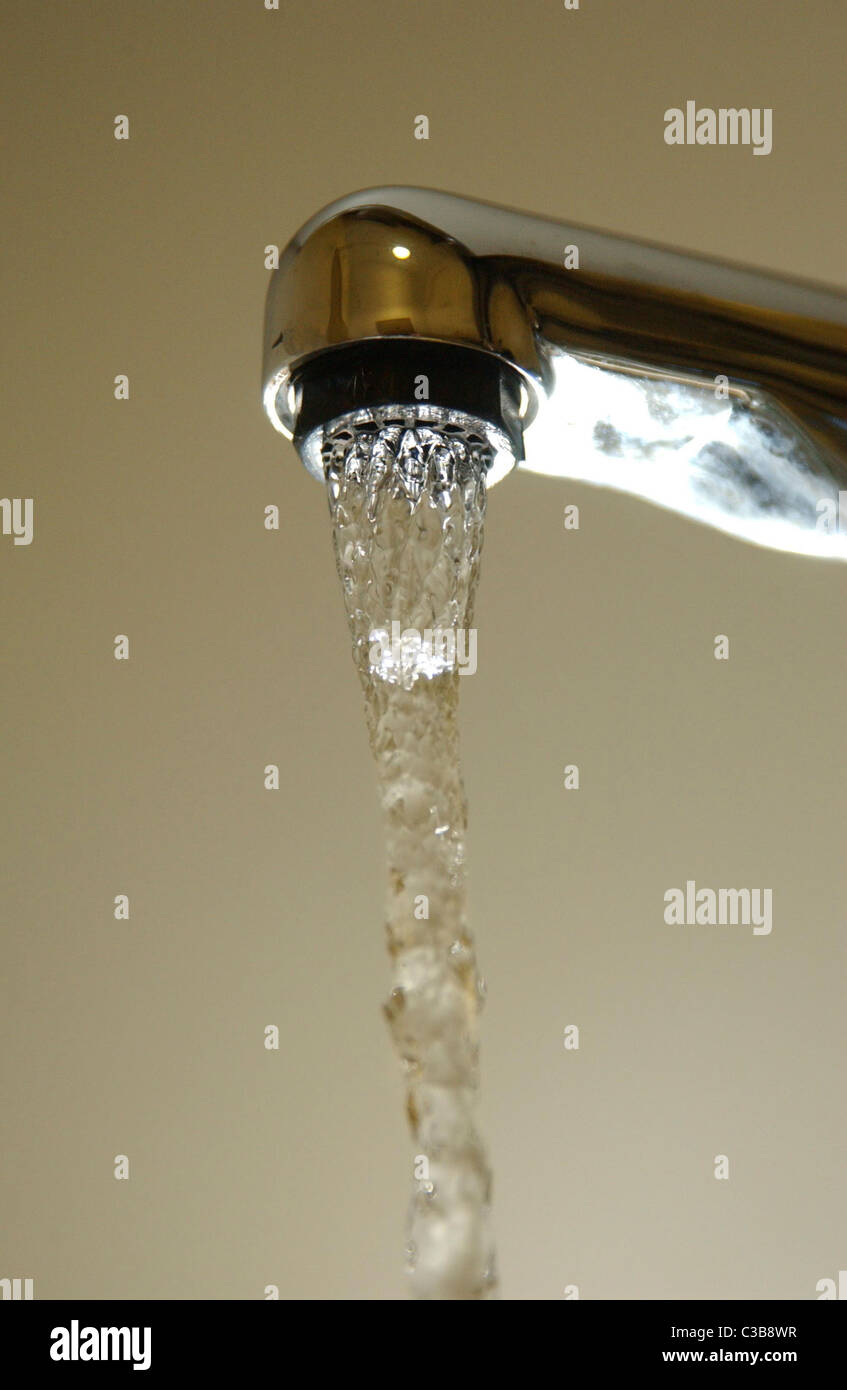 A tap with running water Stock Photo - Alamy