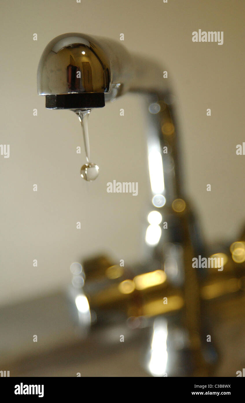 A tap with running water Stock Photo - Alamy