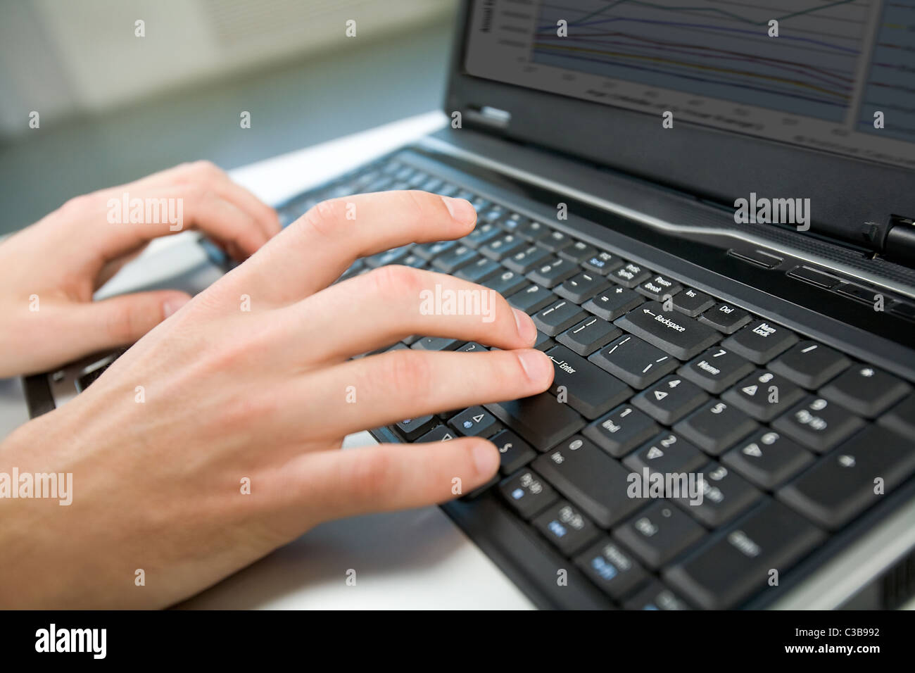 Close-up of male hand over black keyboard of laptop during typing Stock ...