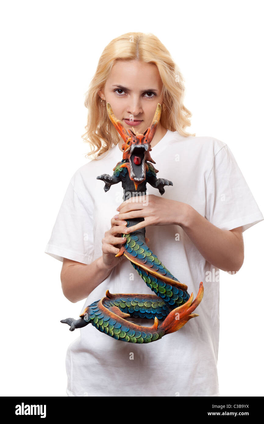 beautiful girl with a wooden dragon isolated on a white background ...