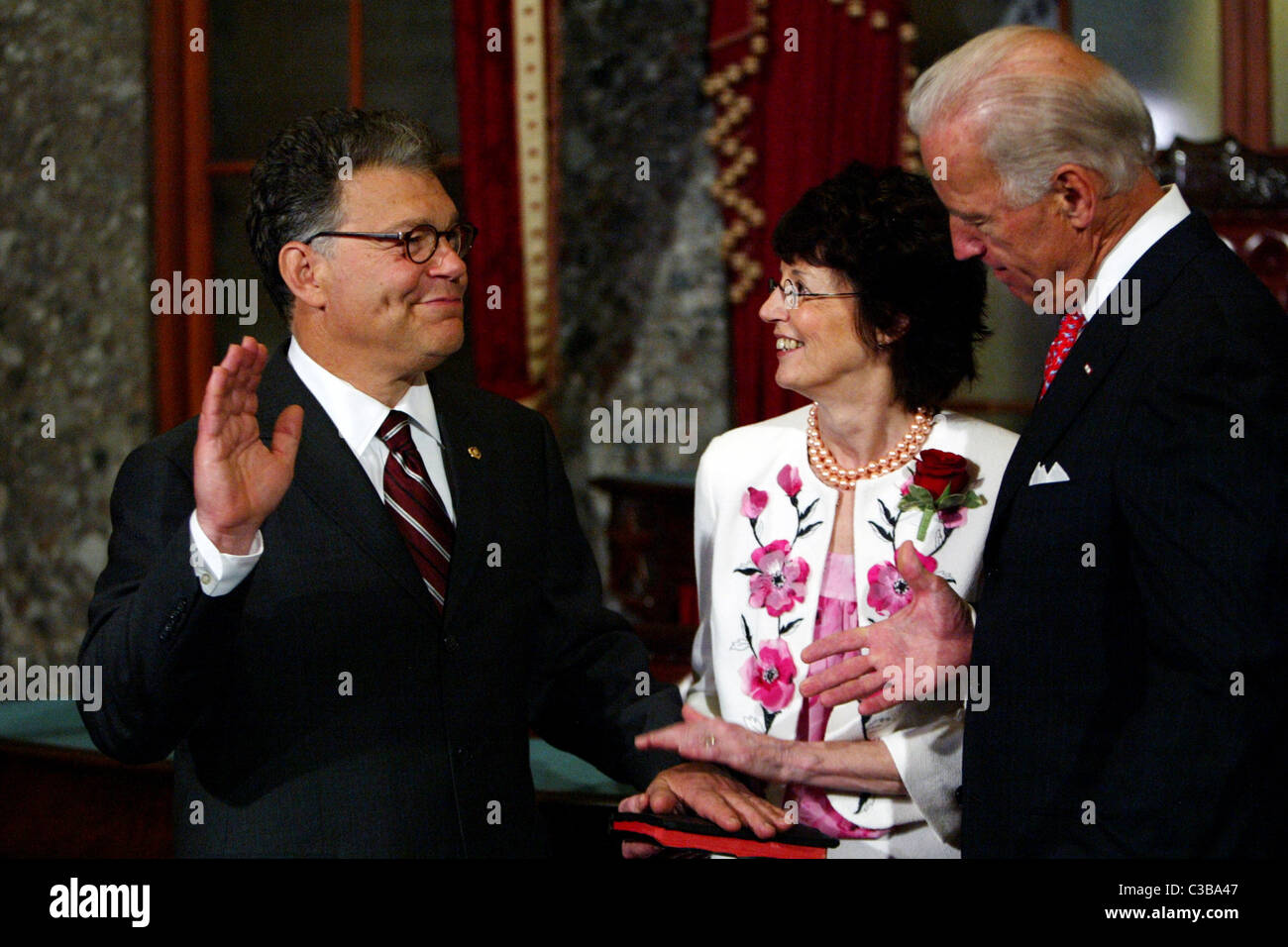 US Senator Al Franken is sworn in by Vice President Joseph Biden as his ...
