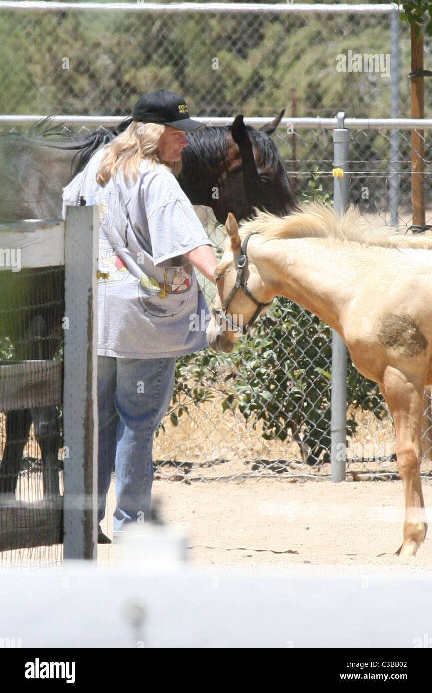 Debbie Rowe spends time with her horses at home on the day of her ex ...