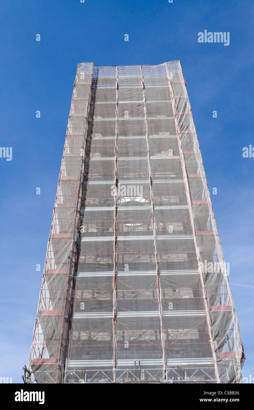Bell tower in scaffolding being restored and renovated Stock Photo - Alamy