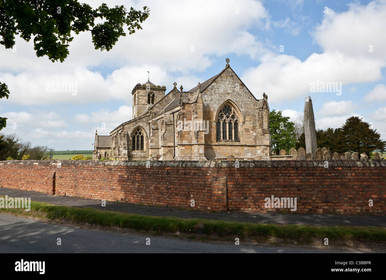 Rudston monolith saints church rudston hi-res stock photography and ...