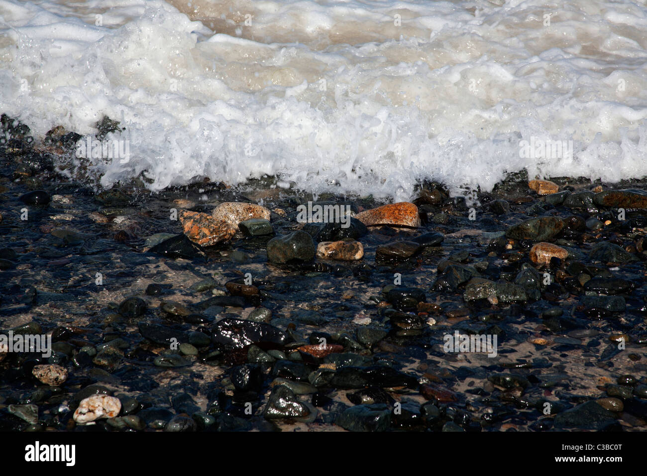 Incoming tide over the pebbles hi-res stock photography and images - Alamy
