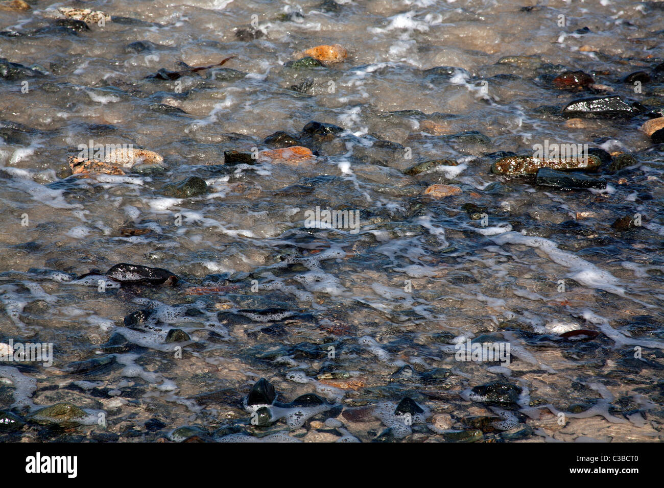 Incoming tide over the pebbles hi-res stock photography and images - Alamy