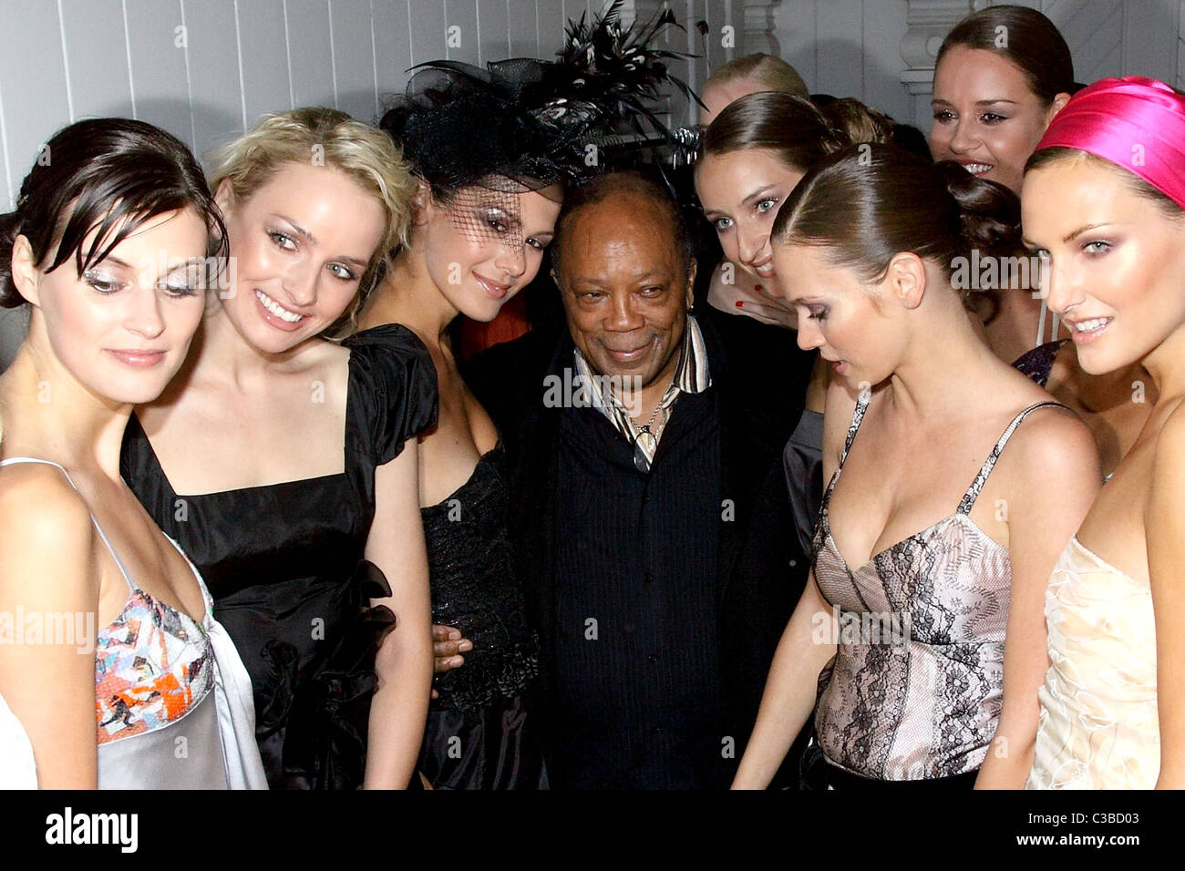 Quincy Jones poses with models after attending the Beata Rajska fashion ...