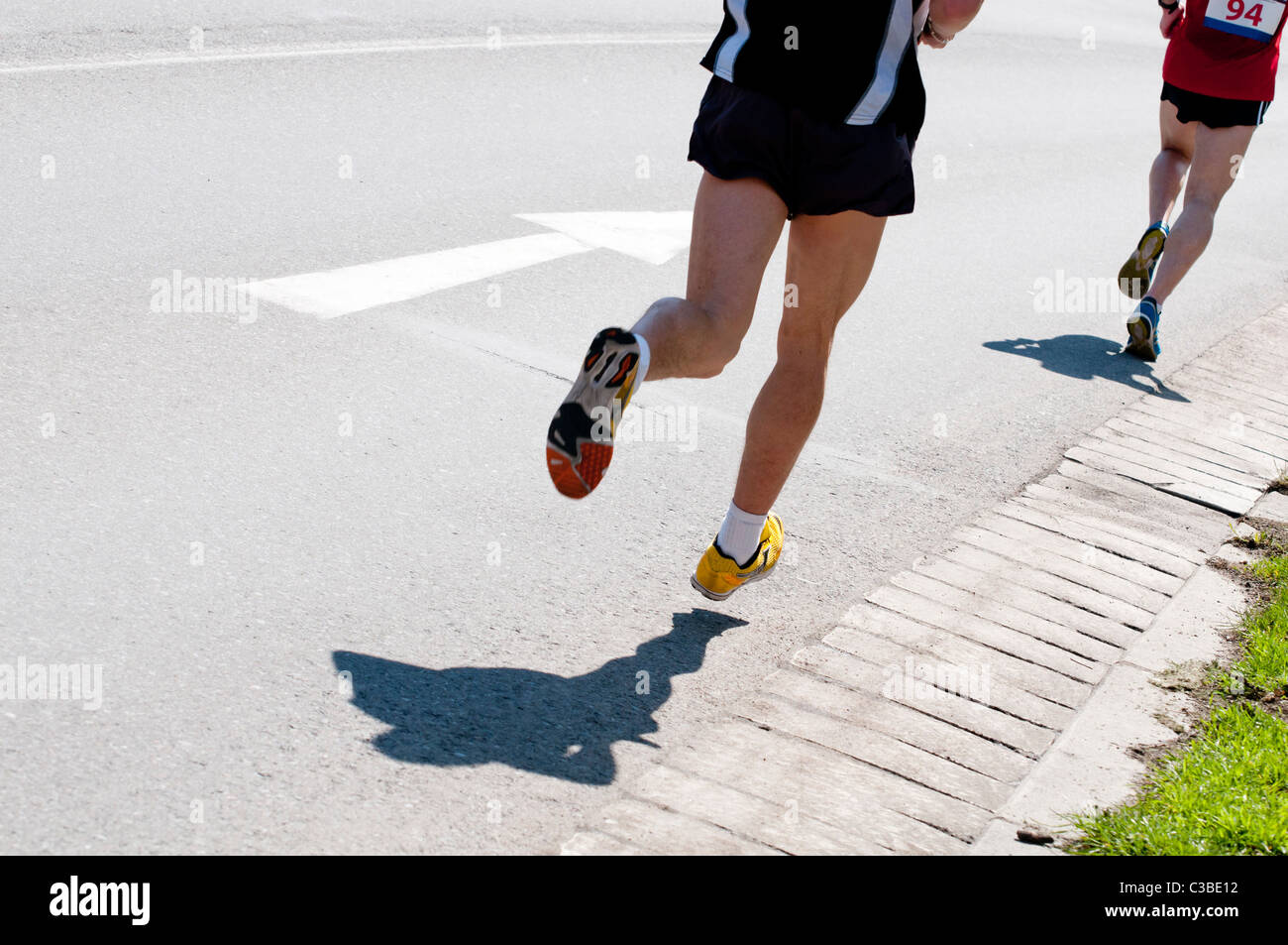marathon runners legs Stock Photo - Alamy
