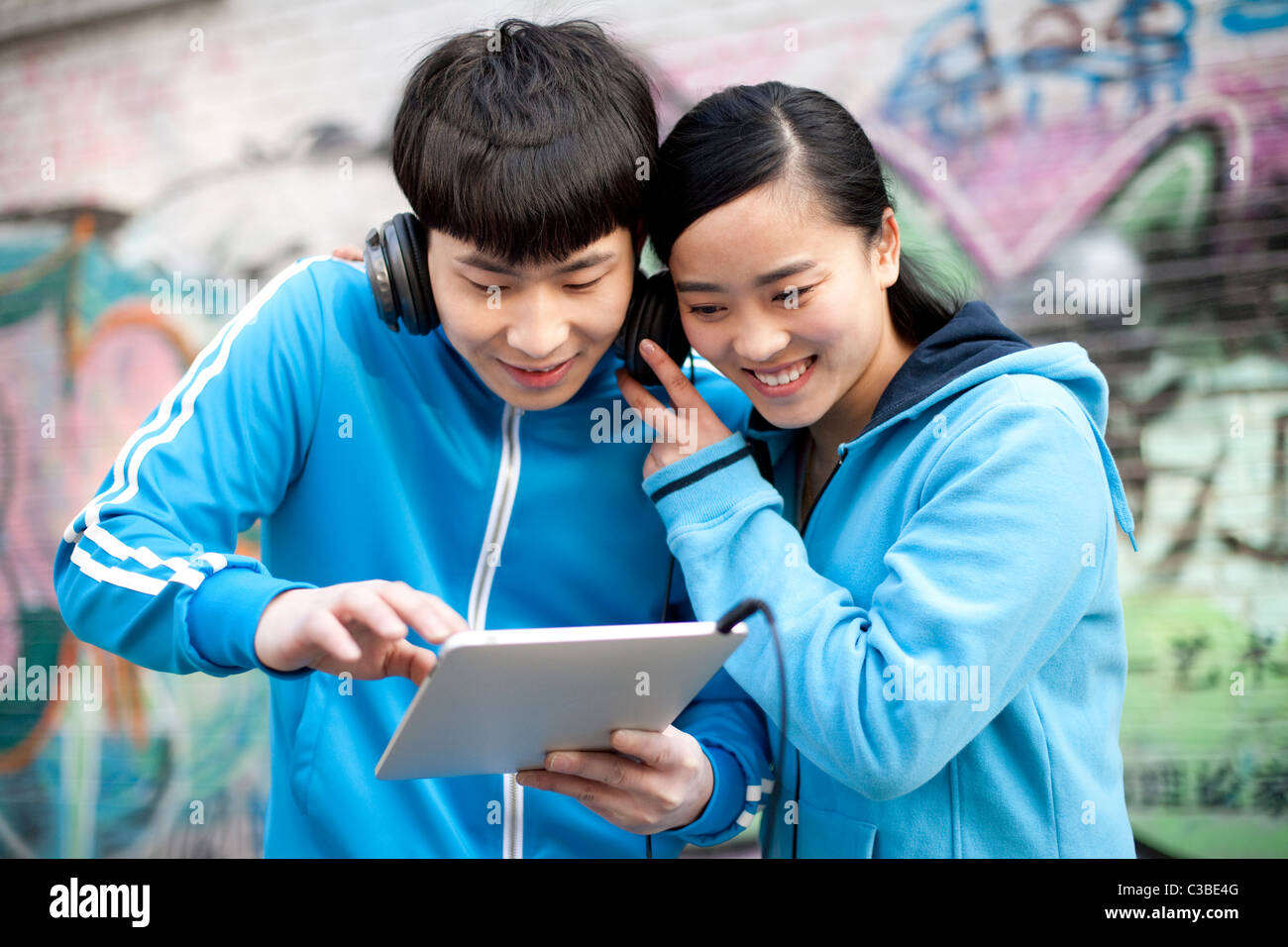 Chinese men using ipad hi-res stock photography and images - Alamy