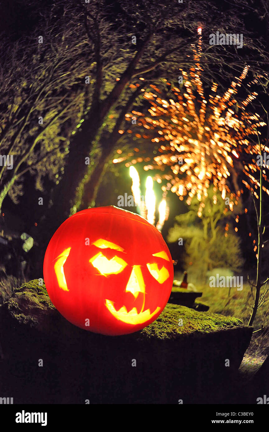Halloween Pumpkin and Firework display in the background Stock Photo ...