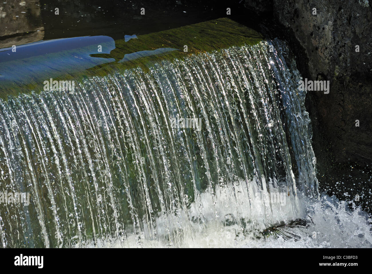 Water flowing over derelict locks on the Northern Reach of the ...