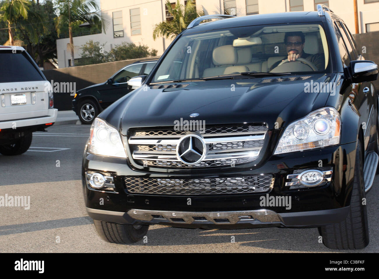 Lionel Richie leaving Maxfield on Melrose Avenue in his Mercedes-Benz ...