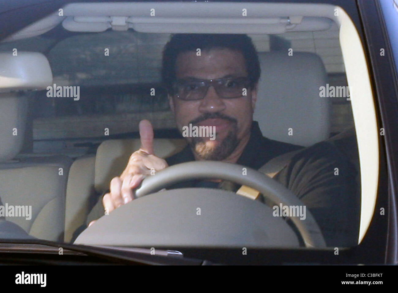 Lionel Richie leaving Maxfield on Melrose Avenue in his Mercedes-Benz ...