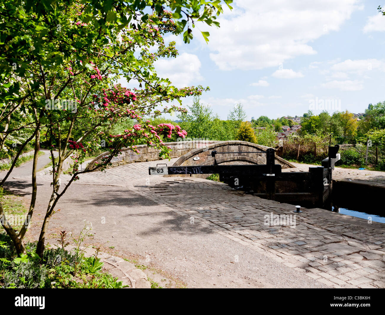 Lock gates and stone bridge on the Rochdale canal, Chadderton, Oldham ...