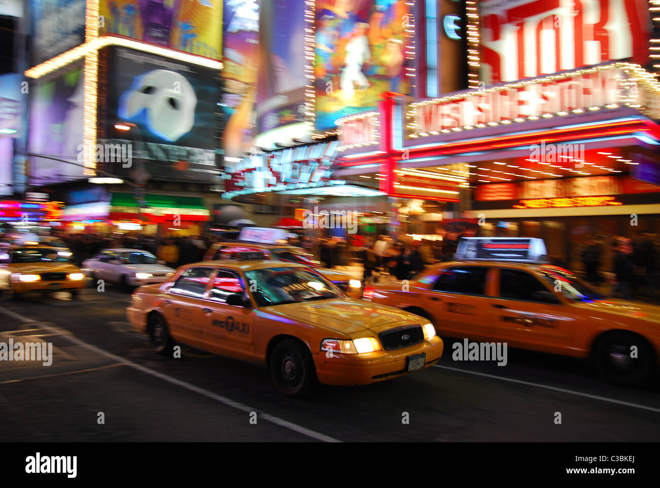 Times Square at night with busy traffic in Midtown Manhattan, New York ...