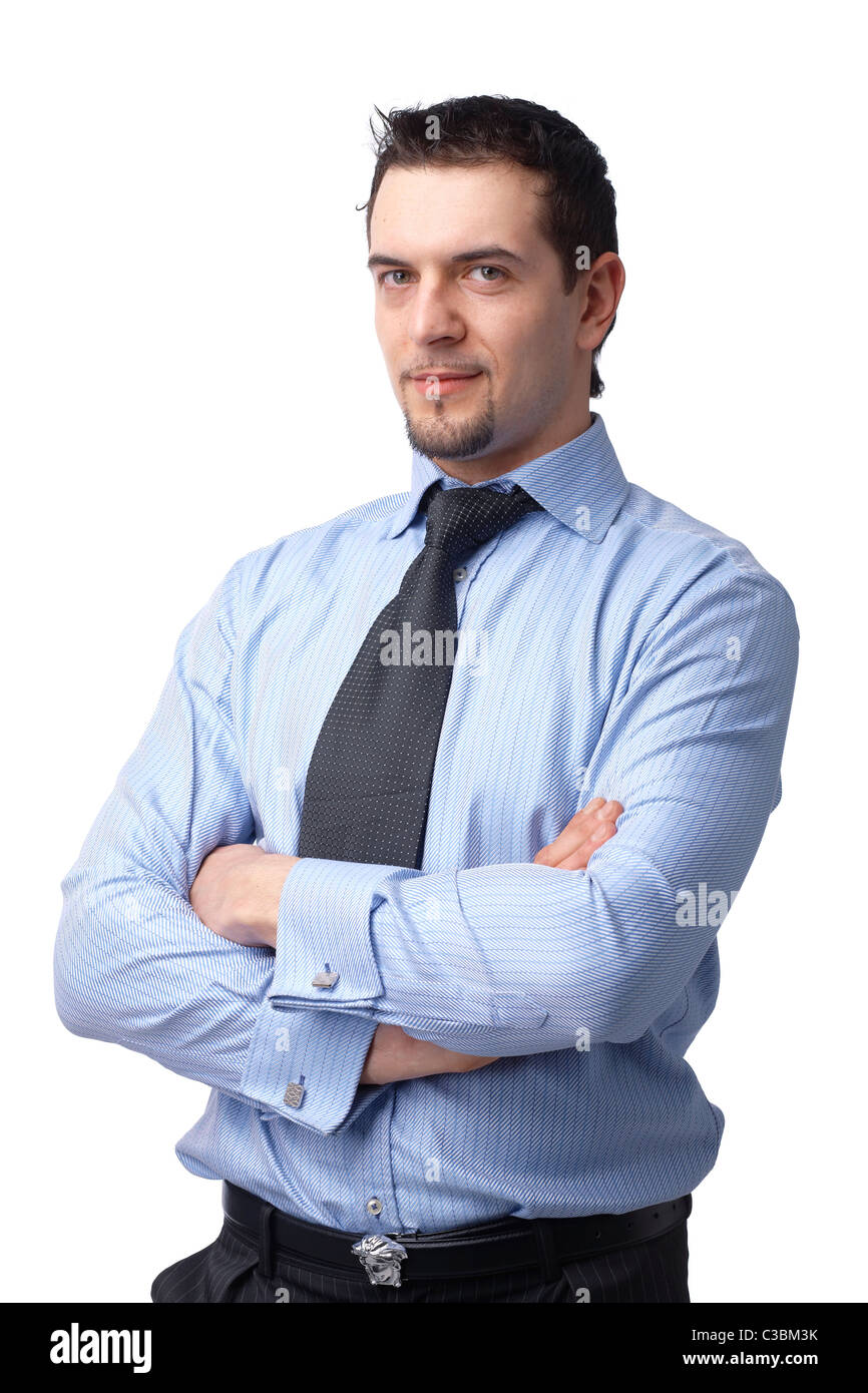 Portrait of successful businessman, smiling with his hands folded over ...