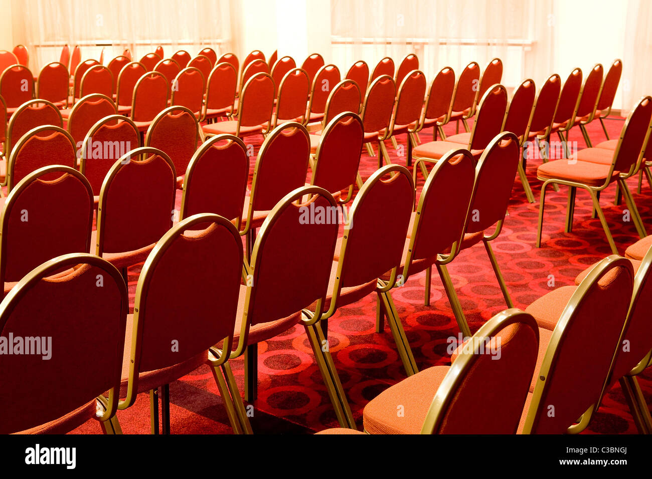 Image of rows of red armchairs in conference hall Stock Photo - Alamy
