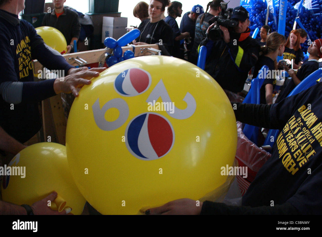 Volunteers inflate tens of thousands of New Year's Eve balloons for ...