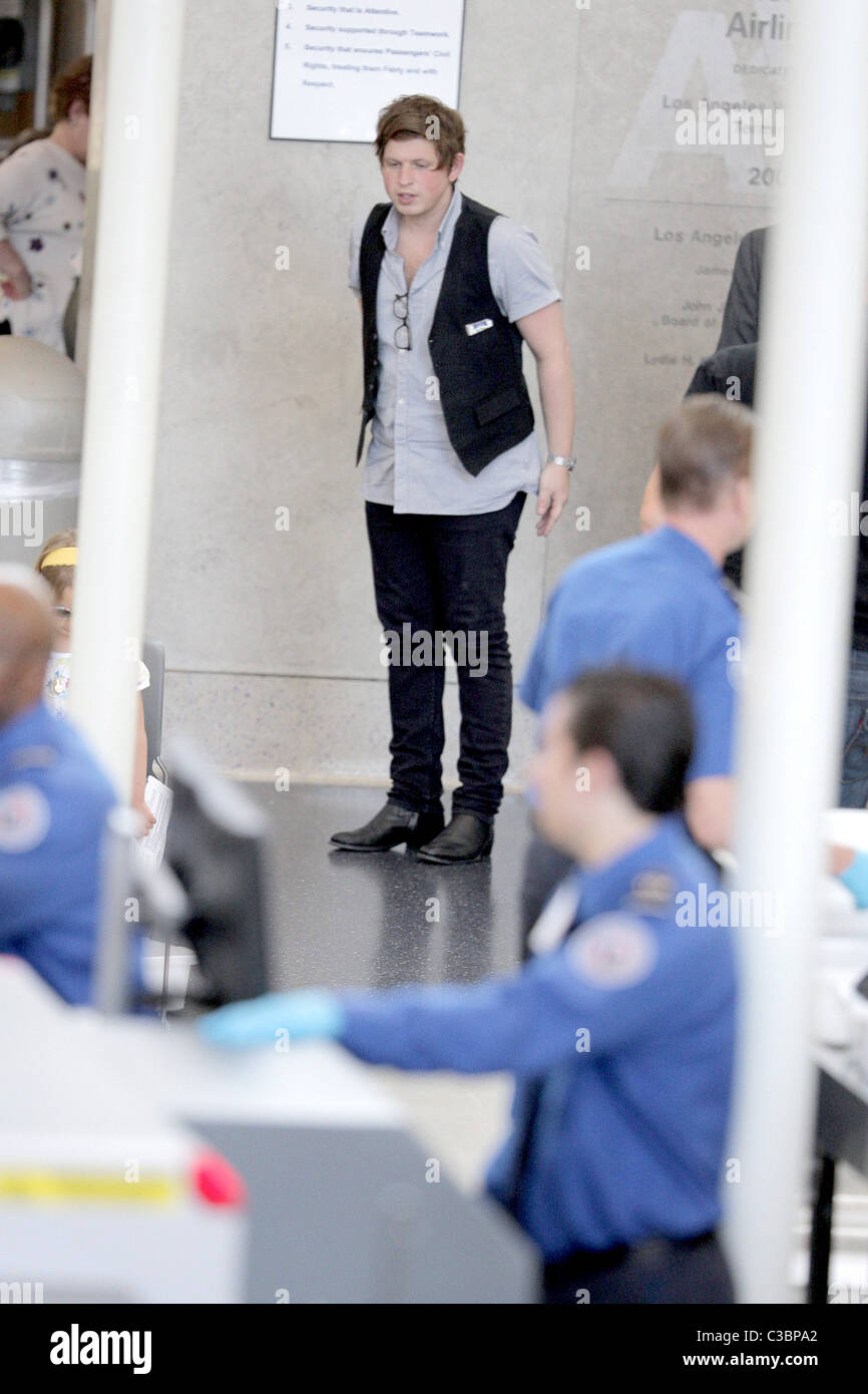 Matthew Followill from the band Kings of Leon boarding an American ...
