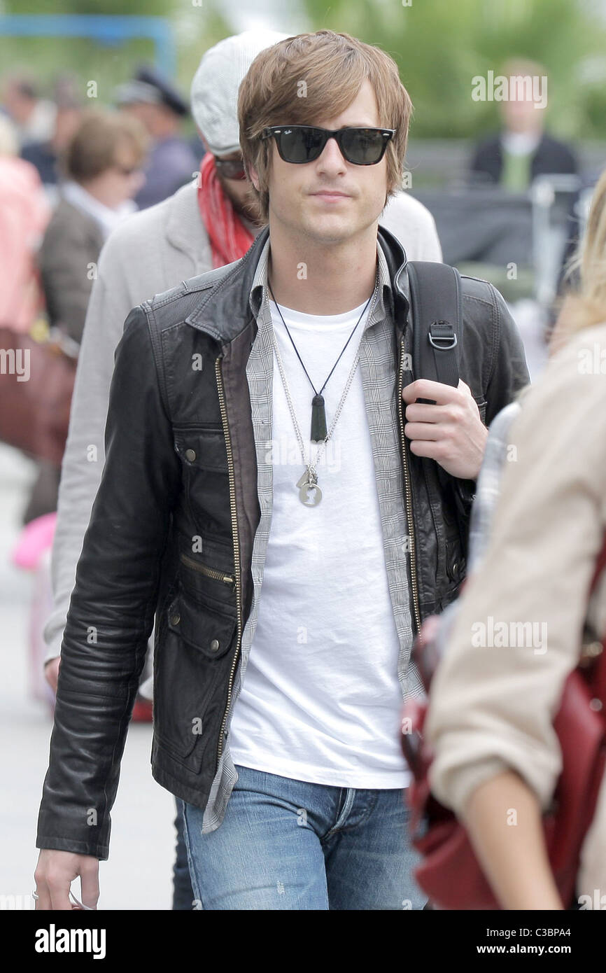 Jared Followill from the band Kings of Leon boarding an American ...