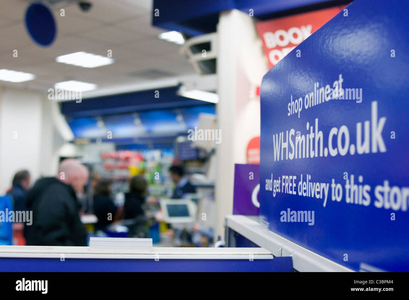 A whsmith.co.uk advert, with customers queuing inside a WH Smith store ...
