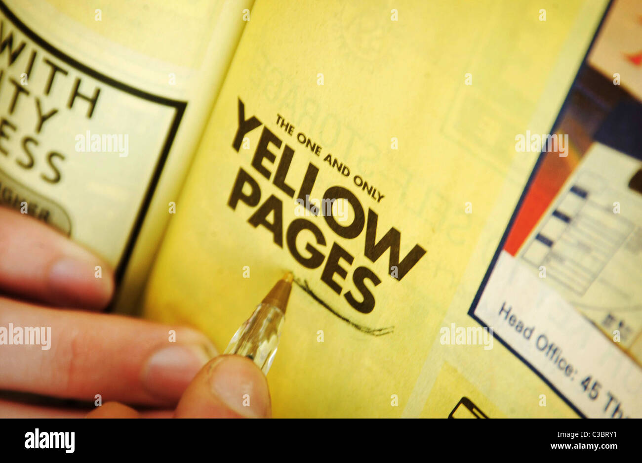 A man using the Yellow Pages telephone Directory Stock Photo - Alamy
