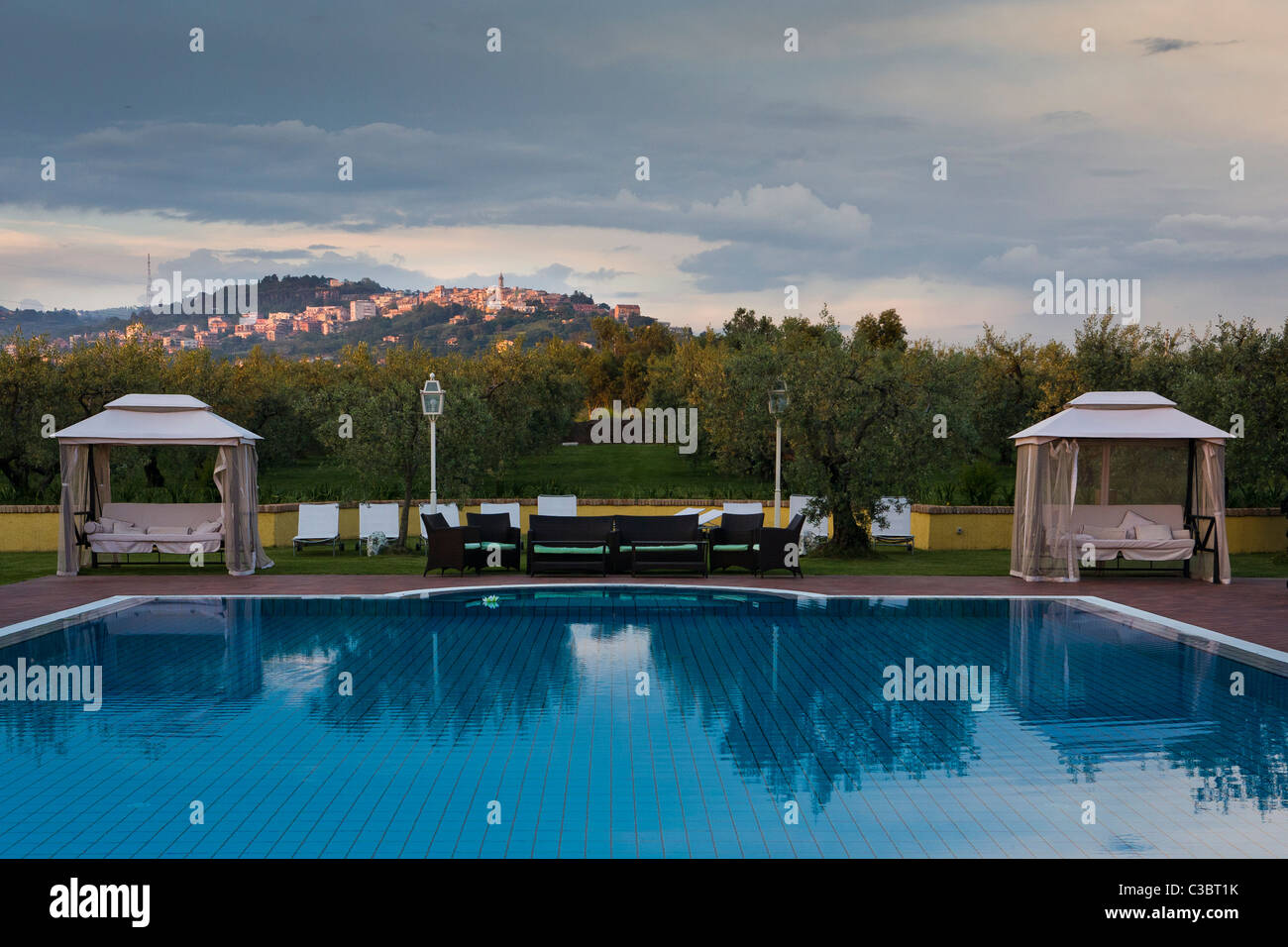 Luxury swimming pool overlooking Italian landscape, Italy, Europe Stock ...