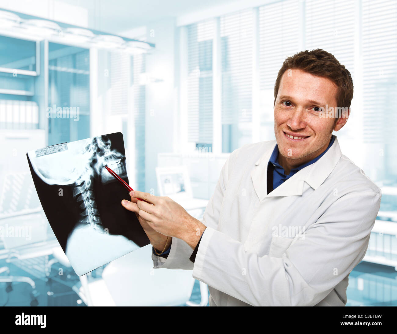 smiling young doctor check xray in office Stock Photo - Alamy