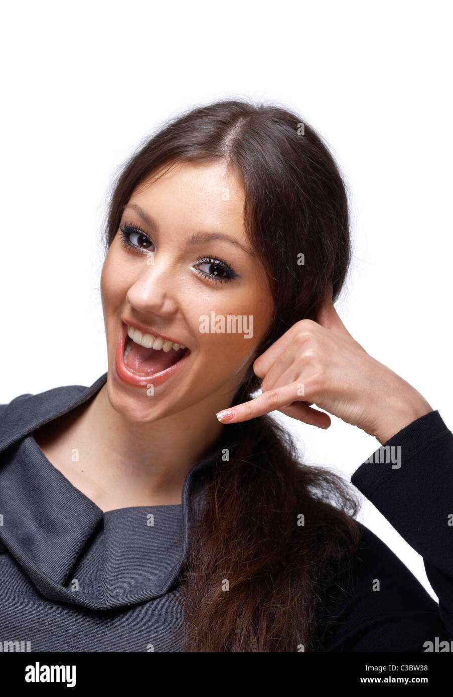 Portrait of a happy young female gesturing a call me sign isolated on ...