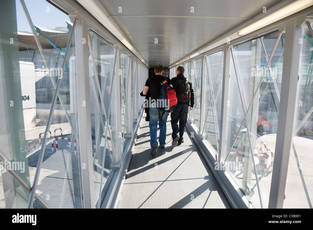 Passenger / passengers leave / leaving plane / airplane / aeroplane via ...