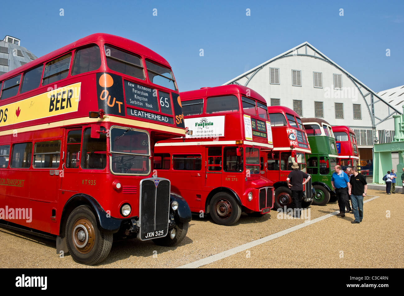 A line of historic buses on display at the Chatham Historic Dockyard ...