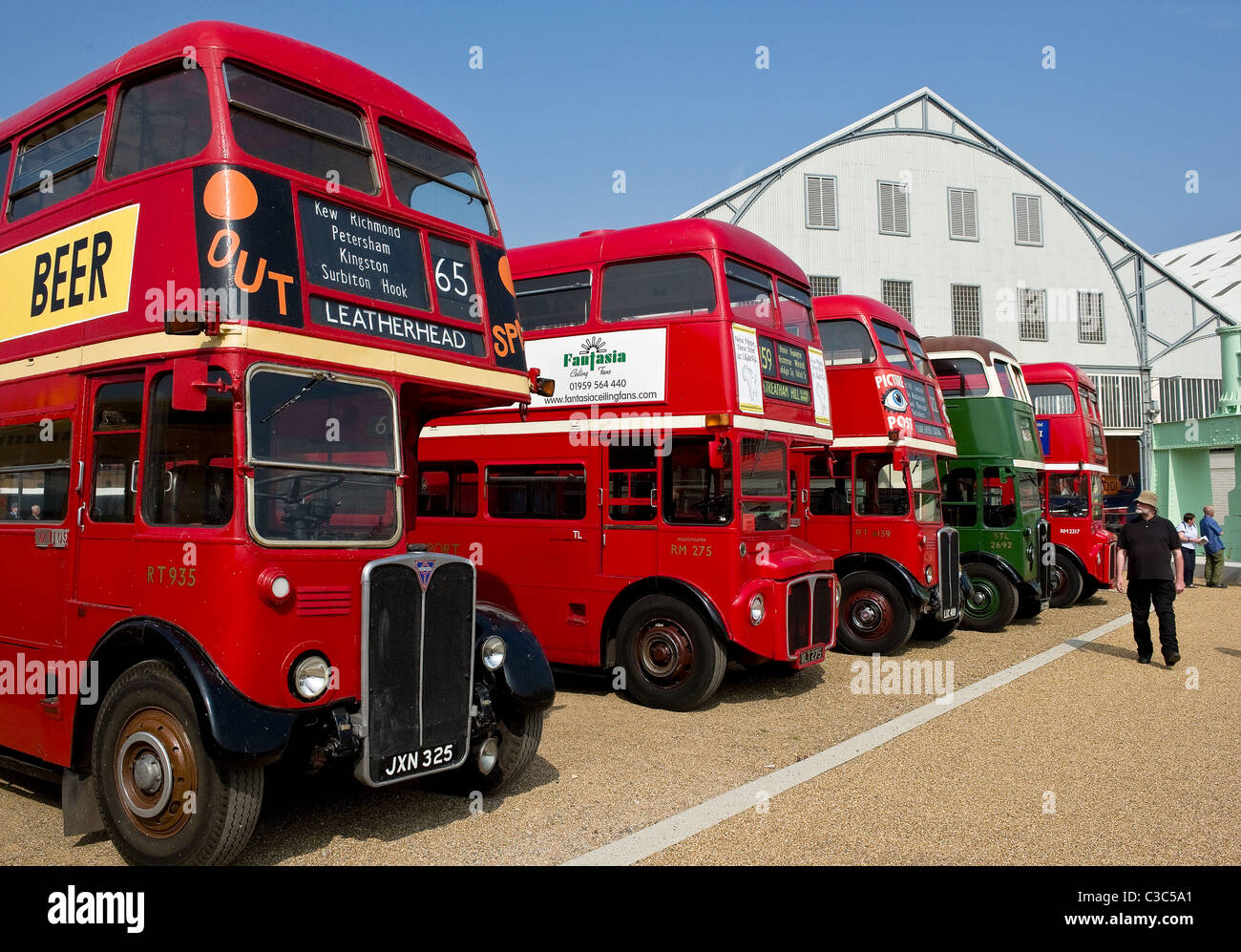 A line of historic buses on display at the Chatham Historic Dockyard ...