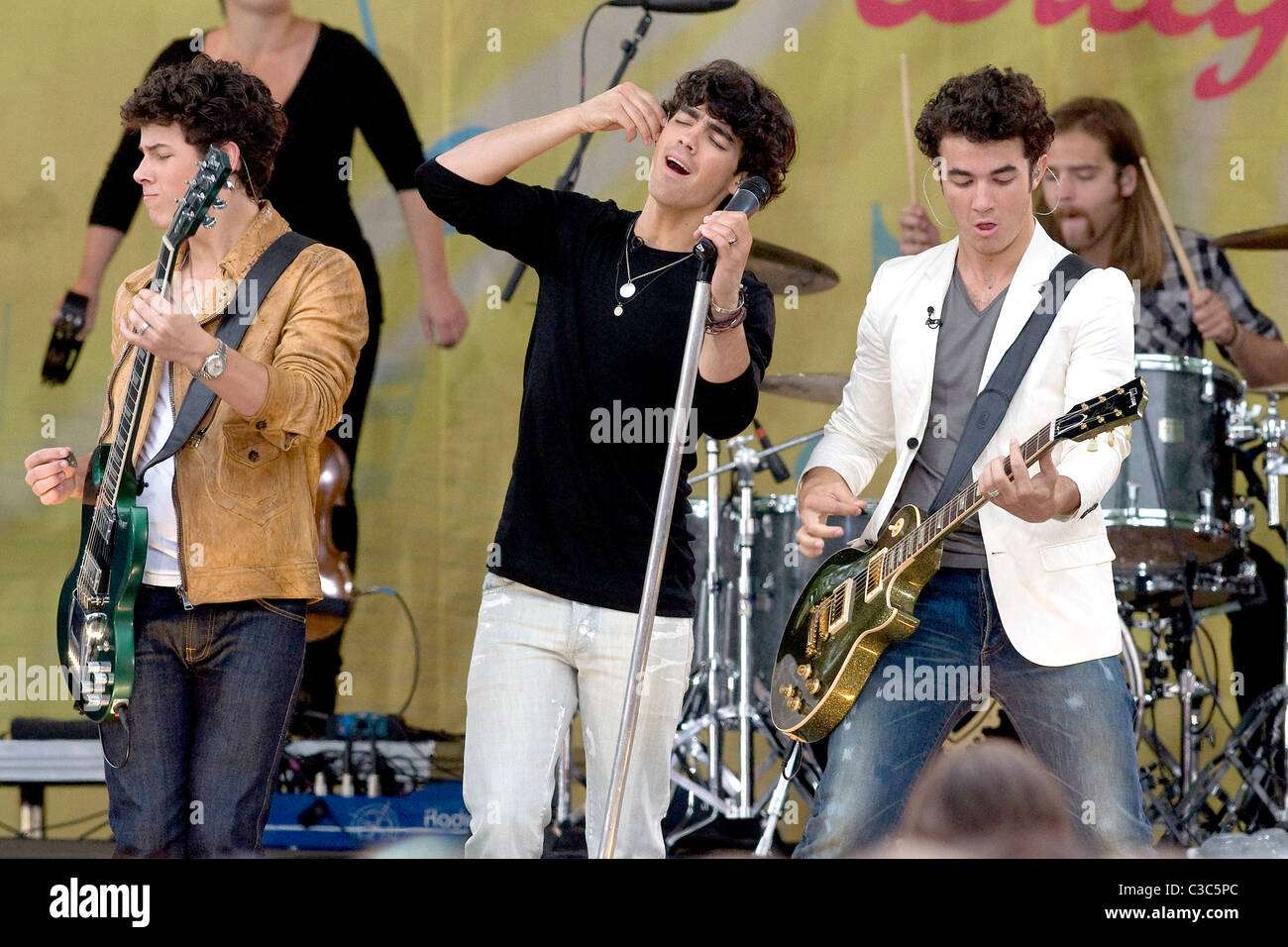 Nick Jonas, Joe Jonas and Kevin Jonas Jonas Brothers performing live as ...
