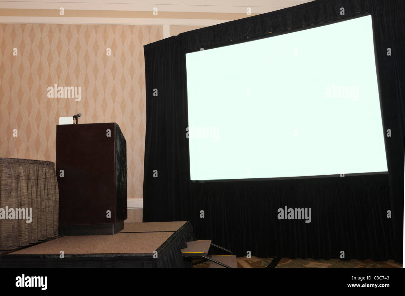 Blank projection screen and podium in empty room Stock Photo - Alamy