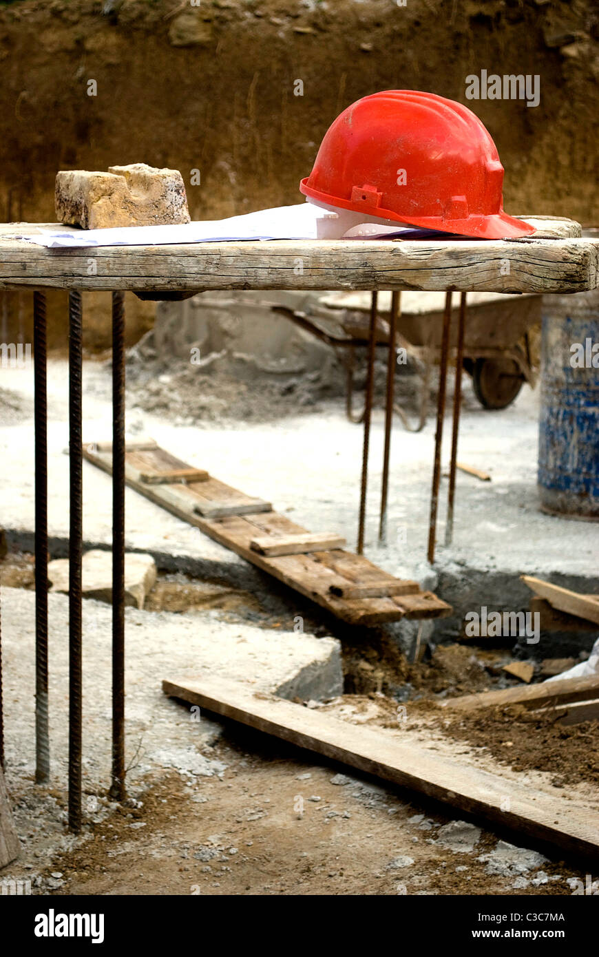 construction site red hard hat and project over wooden boards Stock ...