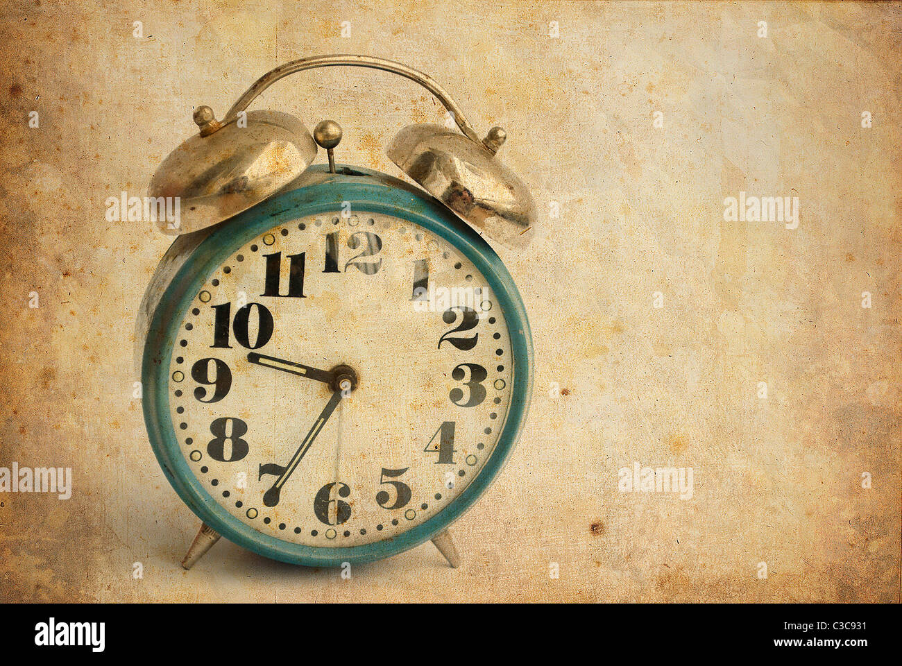 old and rusty alarm clock isolated on vintage background Stock Photo ...