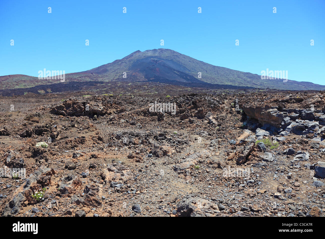 Volcanic desert at Tenerife Canary island. Blue sky, arid dry sand heat ...