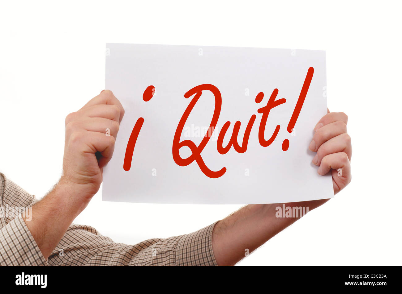 Man is holding a piece of white paper, "I Quit" printed on the paper ...