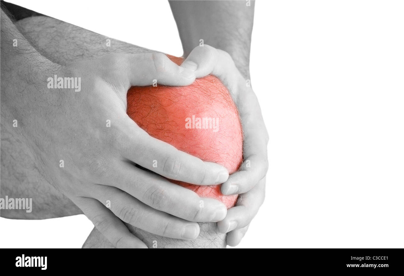 man having pain in his knee making massage Stock Photo - Alamy